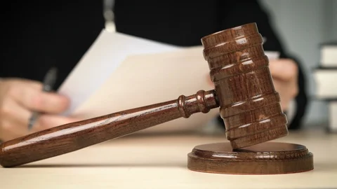 Judge working with papers behind desk in... | Stock Video | Pond5