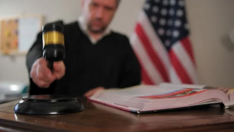Judge's hand with wooden judge gavel, Fo... | Stock Video | Pond5