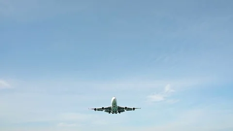 Jumbo jet airplane flying slow motion ov... | Stock Video | Pond5