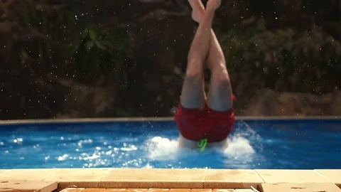 Jump into the blue pool head down and a ... | Stock Video | Pond5