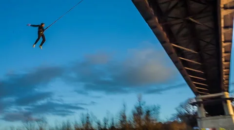 jump off a bridge on the background of b... | Stock Video | Pond5