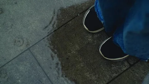 Jumping in the puddle. Woman steps in a ... | Stock Video | Pond5