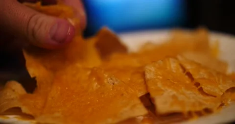 Junk food cheese nachos and grabbing nac... | Stock Video | Pond5