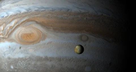 Jupiter planet and Io moon in the outer ... | Stock Video | Pond5