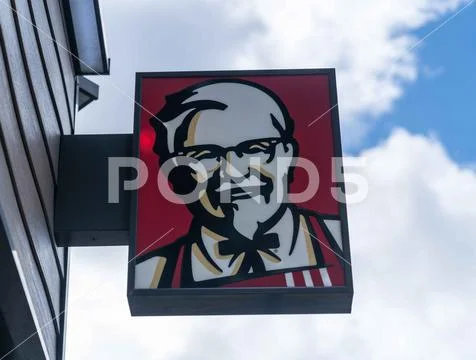A KFC Colonel Sanders logo sign outside a KFC restaurant ~ Premium ...