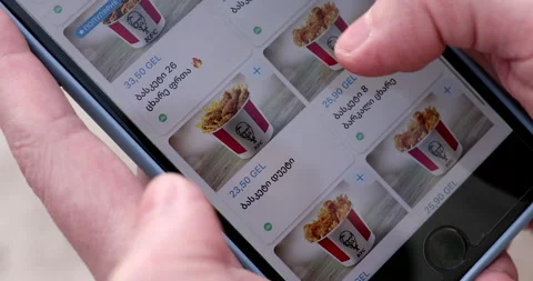 KFC. Man Chooses Food with Delivery in t... | Stock Video | Pond5