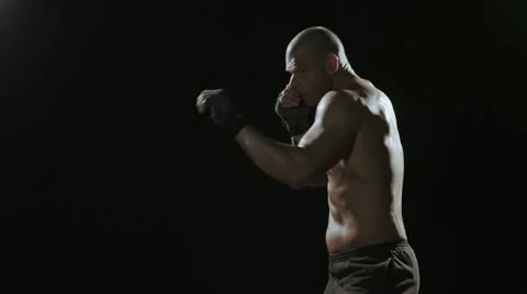 Kickboxer shadow boxing as exercise for ... | Stock Video | Pond5