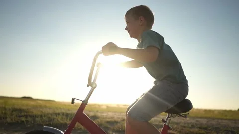 kid bike riding on a park. kid boy rides... | Stock Video | Pond5