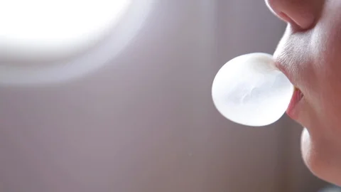 kid blowing bubble chewing gum while sit... | Stock Video | Pond5