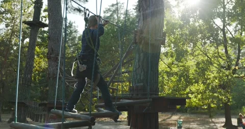 Kid Boy Climbing Walking Rope Park Adven... | Stock Video | Pond5