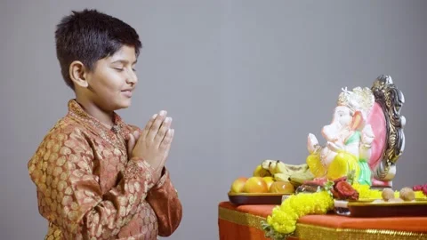 Kid boy doing namaste to ganesh in gray ... | Stock Video | Pond5
