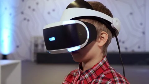 kid boy using VR-headset display for vir... | Stock Video | Pond5