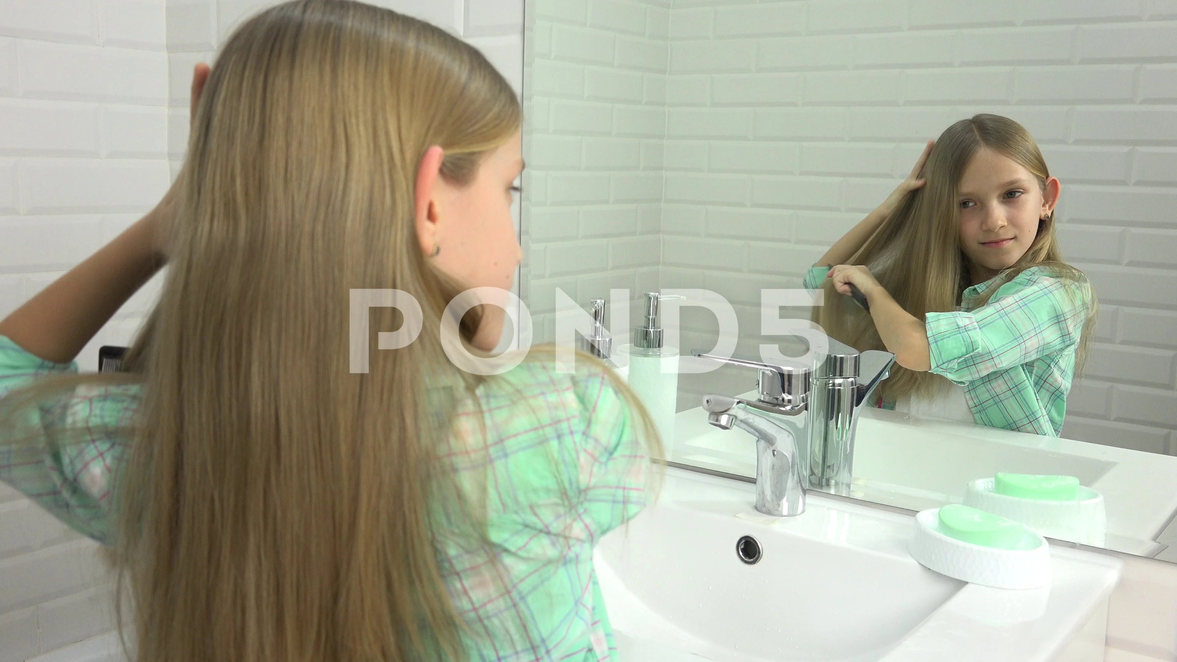 Girl Brushing Hair In Mirror