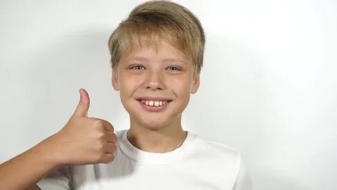 kid nodding his head saying yes and puti... | Stock Video | Pond5