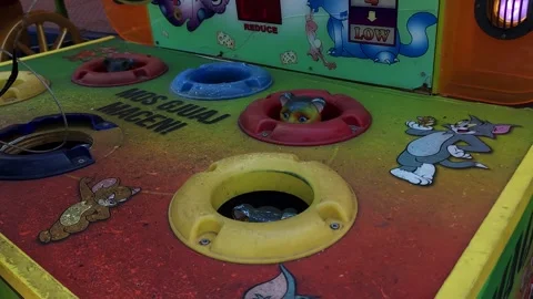 Kid playing with Whac-A-Mole arcade game... | Stock Video | Pond5