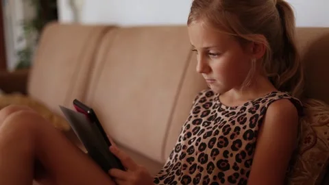 Kid read book on a tablet, side view of ... | Stock Video | Pond5
