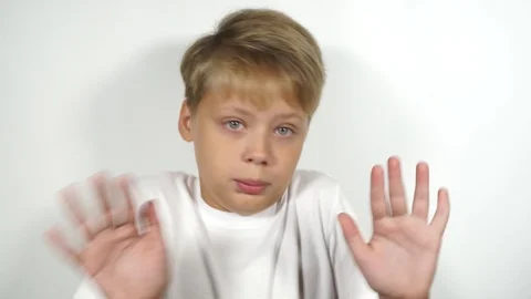 kid saying no, shaking his head and hand... | Stock Video | Pond5