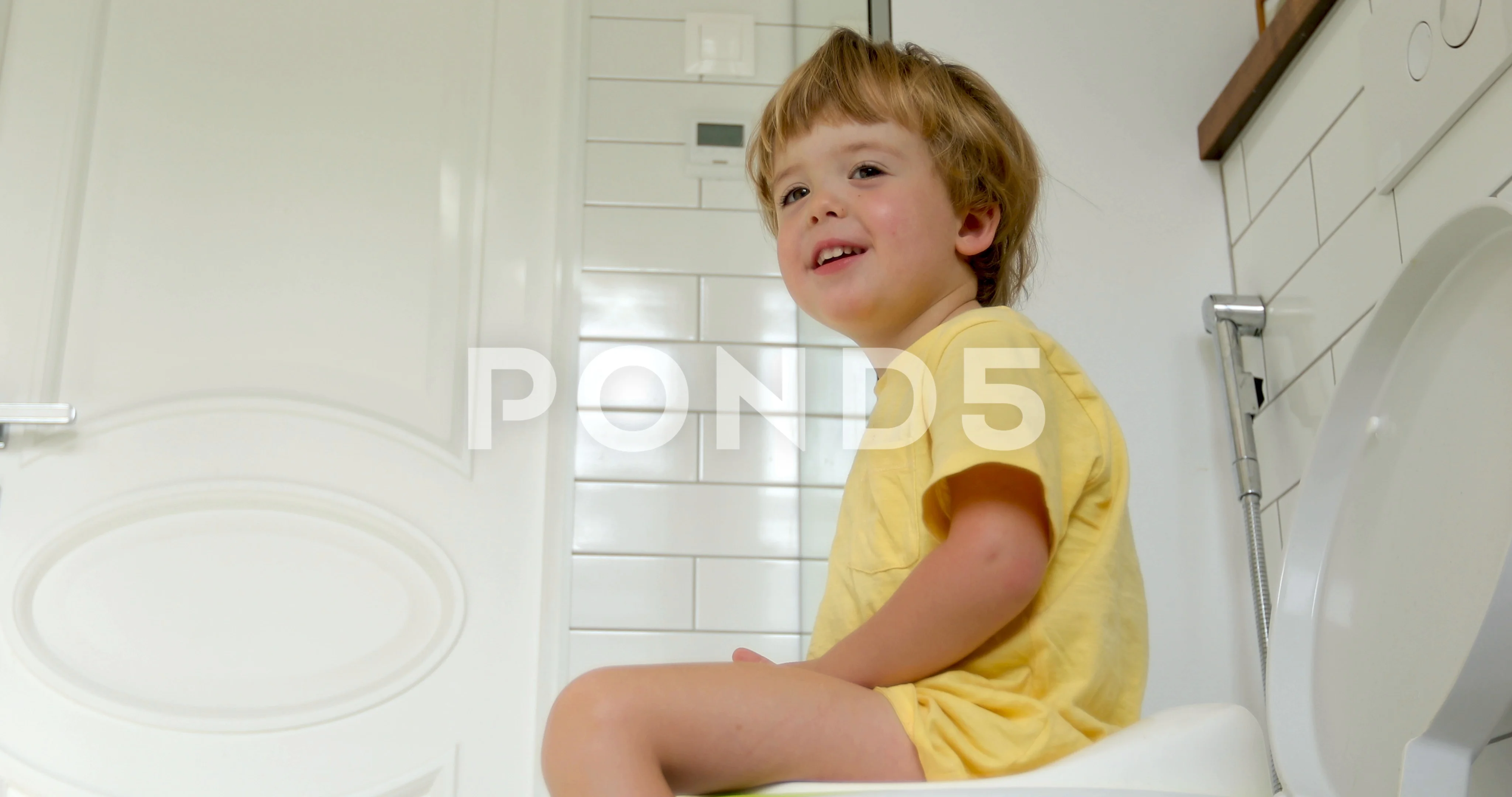 Child Using The Toilet