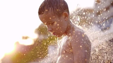 Kid Shower The Sun Stock Video Footage | Royalty Free Kid Shower The ...