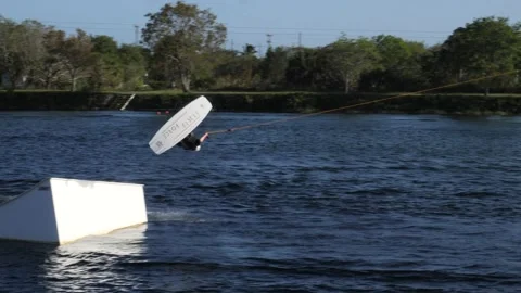 Kid Wakeboarding Flipping Over Ramp Spla... | Stock Video | Pond5