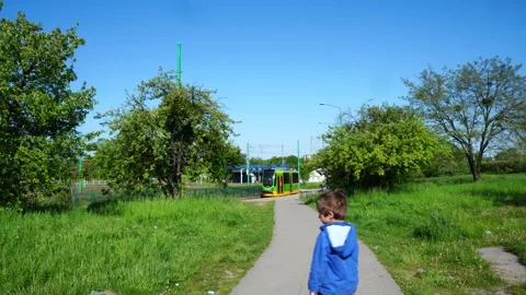 Kid walking on a path with a background ... | Stock Video | Pond5