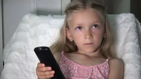 Kid Watching TV, Child Using Remote Cont... | Stock Video | Pond5