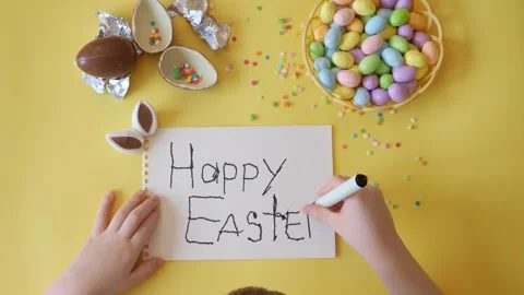 Kid write Easter Greeting card Yellow ba... | Stock Video | Pond5
