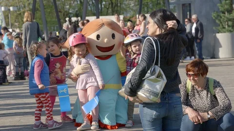 Kids are hugging te mascot | Stock Video | Pond5