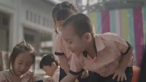 Kids are playing together on sand ground... | Stock Video | Pond5