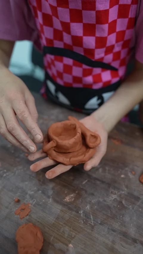 Kids are using clay on a craft wooden ta... | Stock Video | Pond5