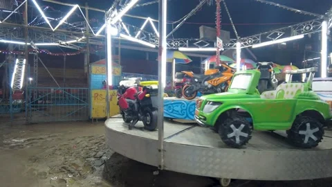 Kids' Cars Spinning at the Fair during t... | Stock Video | Pond5