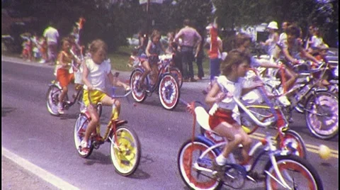 Kids CHILDREN RIDE on Bikes in Parade 19... | Stock Video | Pond5