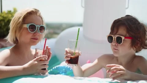 kids chilling in the inflatable pool at ... | Stock Video | Pond5