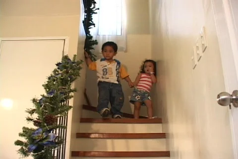 Kids coming down from the stairs | Stock Video | Pond5