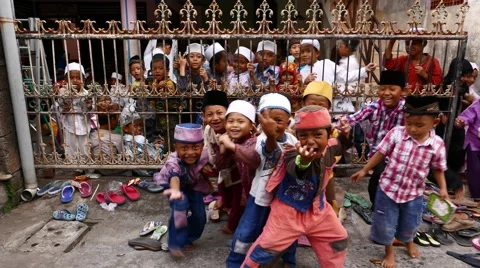 Kids crowd together like pose to camera,... | Stock Video | Pond5