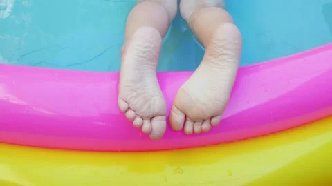 Kids feet laying relaxing on colorful in... | Stock Video | Pond5