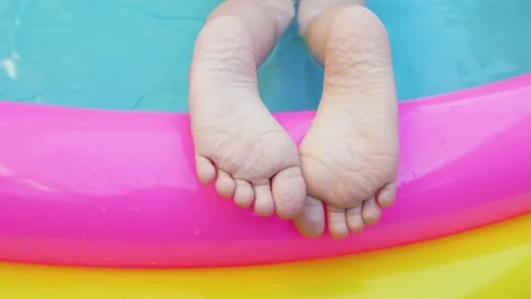 Kids feet laying relaxing on colorful in... | Stock Video | Pond5
