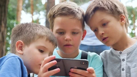 Kid Using Iphone Stock Footage ~ Royalty Free Stock Videos | Pond5