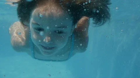 Kids. Girl diving in swimming pool. Supe... | Stock Video | Pond5