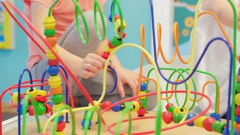 Kids Hands Playing Wooden Wire Maze Educ... | Stock Video | Pond5