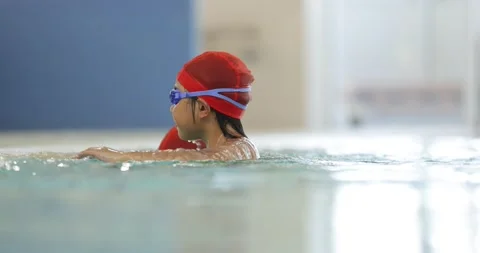 Kids having fun at indoor swimming pool | Stock Video | Pond5
