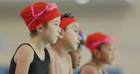 Kids having fun at indoor swimming pool | Stock Video | Pond5
