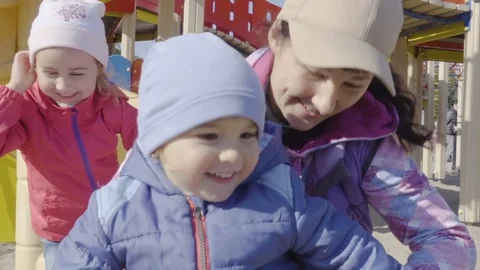 Kids having fun on slide. Happy children... | Stock Video | Pond5