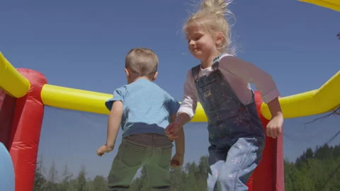 Kids Jumping On Bounce House | Stock Video | Pond5