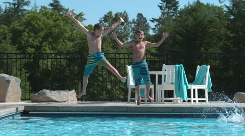 Kids jumping into pool in super slow mot... | Stock Video | Pond5