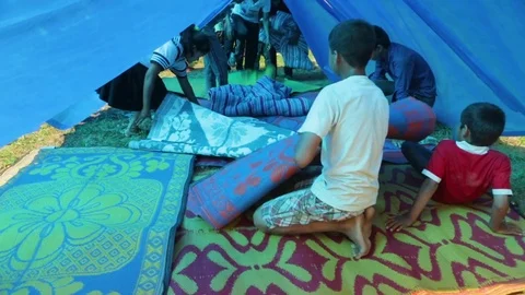 Kids laying mat in the tent at earthquak... | Stock Video | Pond5