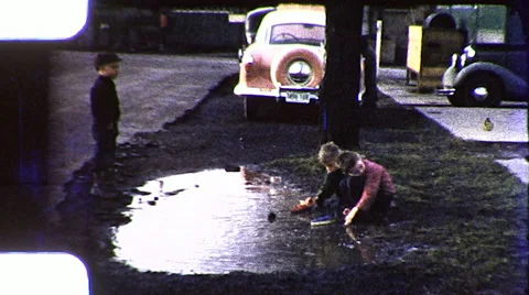 Kids Play in Mud Puddle Rain Water Vinta... | Stock Video | Pond5