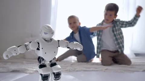 kids play with robot at home, modern whi... | Stock Video | Pond5