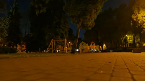 Kids playground in a park at night. 4K | Stock Video | Pond5