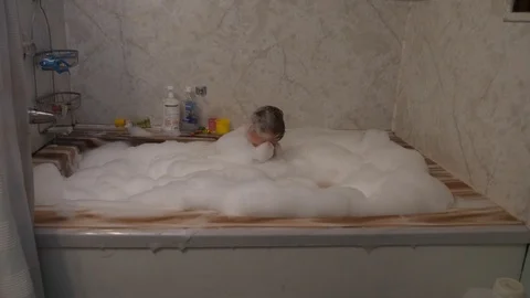 Kids playing in a bubble bath | Stock Video | Pond5